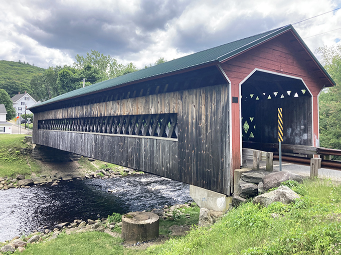 The Ware-Hardwick Covered Bridge stands proudly over rushing waters, its weathered wood telling stories of centuries past.