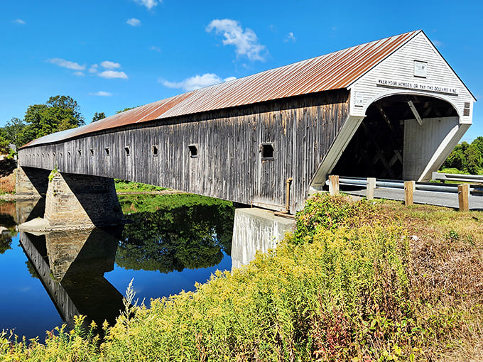 Time stands still at the Cornish-Windsor Bridge, where weathered wood and rustic charm have connected two states across the Connecticut River since 1866.