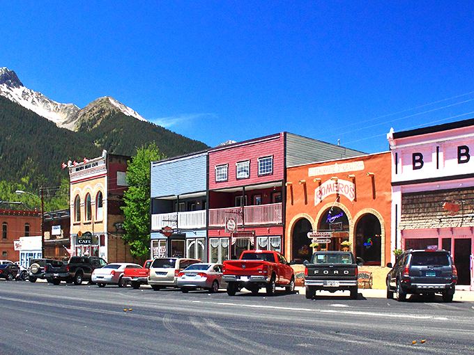 Greene Street's historic storefronts stand like colorful sentinels against the San Juan Mountains, a main drag that hasn't changed its tune in a century.