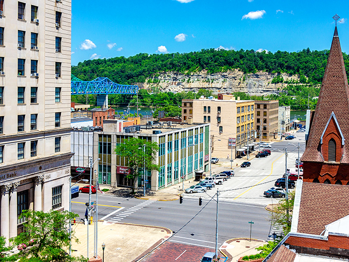 The iconic blue bridge frames Ashland's skyline like a postcard come to life, where limestone cliffs meet historic architecture in perfect harmony.