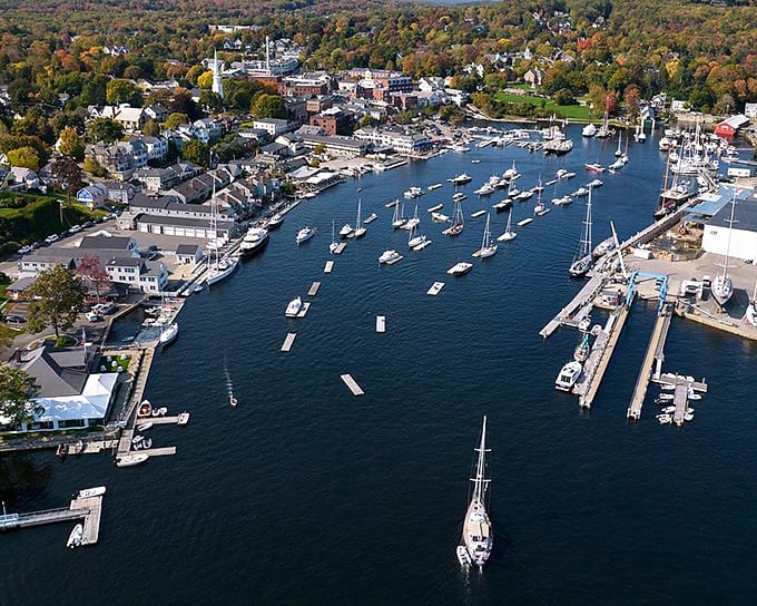 Camden's harbor from above looks like someone scattered sailboats across a perfect blue tablecloth. Where mountains and sea collide in spectacular Maine fashion.