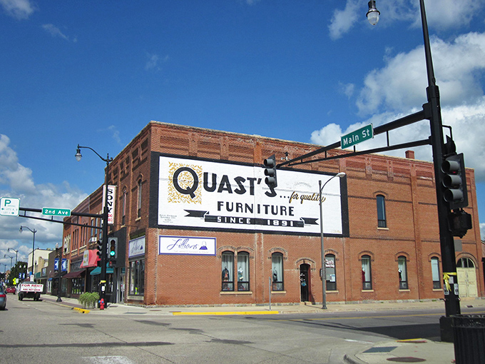 Quast's Furniture has anchored this corner since 1931, a testament to small-town loyalty that big box stores can't replicate.