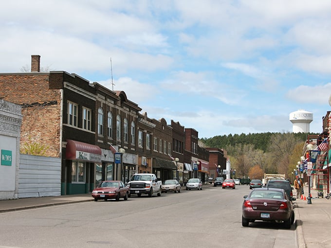 Historic charm meets small-town affordability on Cloquet's main street, where brick buildings whisper stories of generations who've called this riverside community home.