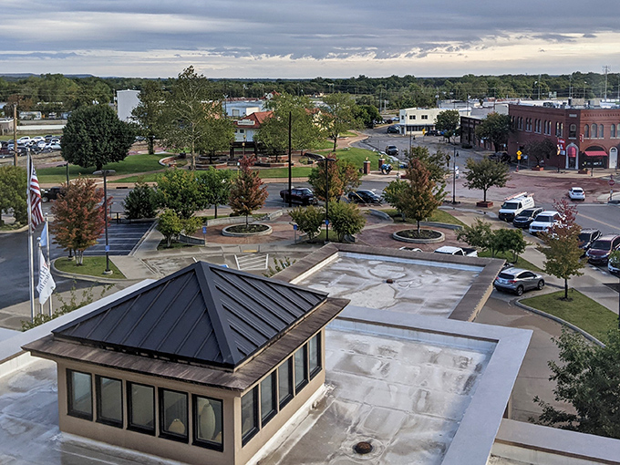 Downtown Bartlesville unfolds like a storybook, where historic brick buildings meet modern amenities under Oklahoma's vast, dramatic skies.