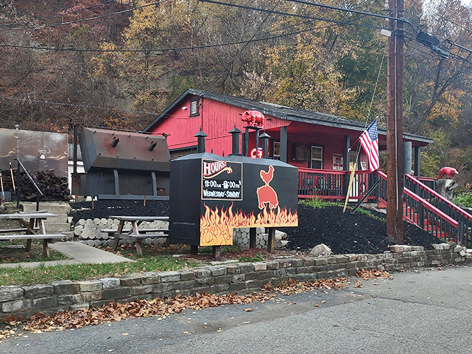 The bright red smokehouse stands like a beacon of barbecue hope against the Pennsylvania hillside. Smoke signals that say "come hungry, leave happy."