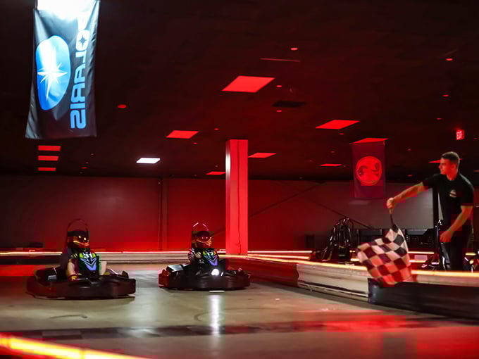 The checkered flag beckons at High Caliber Karting's entrance, promising speed demons a playground where childhood racing dreams come true.