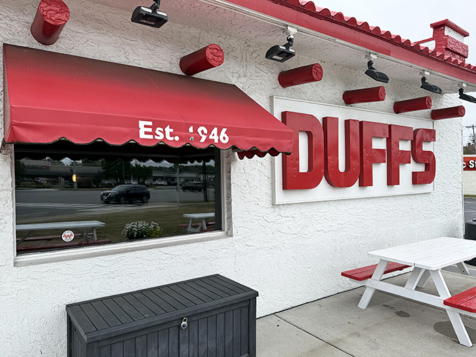 The iconic white exterior with bold red "DUFFS" signage isn't trying to impress you&mdash;until you taste what's inside. Then you're impressed for life.
