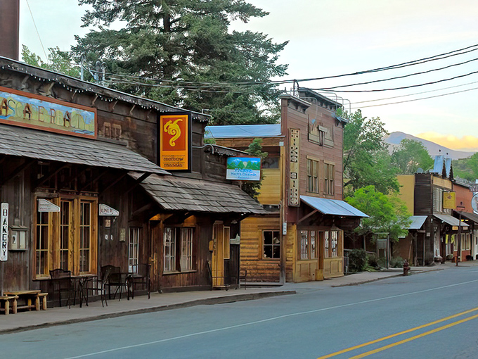Sunset casts a golden glow on Winthrop's wooden storefronts, transforming the main street into a scene straight from a classic Western film.