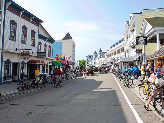 Downtown Mackinac Island bustles with activity as visitors explore shops and restaurants, all without a single automobile in sight.
