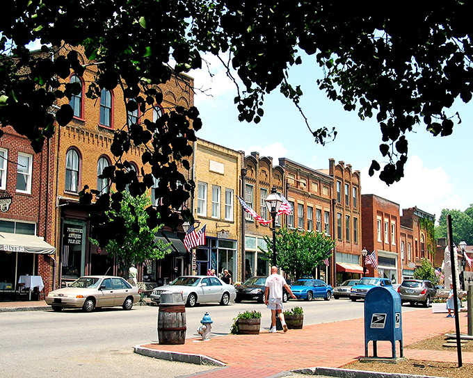 Main Street's brick buildings aren't just preserved—they're alive with stories. The colorful awnings and historic facades create a movie-set perfection that's genuinely authentic.