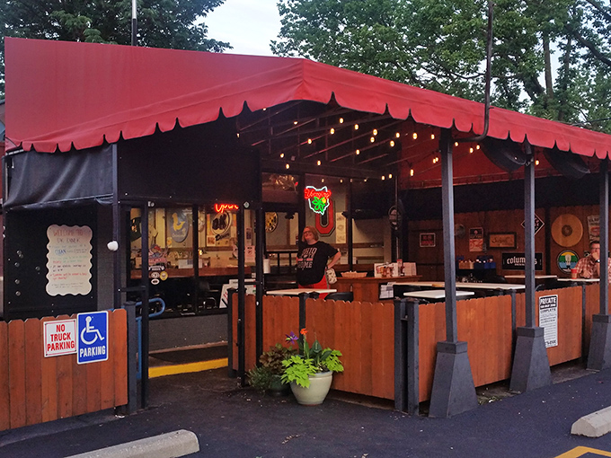 The red awning beckons like a culinary lighthouse, promising comfort food treasures within this unassuming Grandview Heights gem.