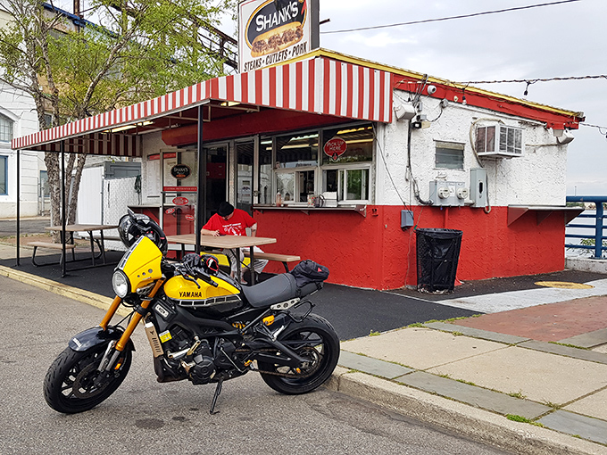 Sporting a vibrant red-and-white striped awning, this Shank's location looks like the kind of place where sandwich dreams and motorcycle adventures begin with equal enthusiasm.