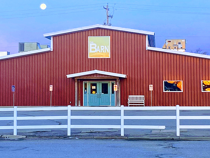 The iconic red exterior of The Barn stands proudly against the Kansas sky, promising comfort food that'll make your heart sing.