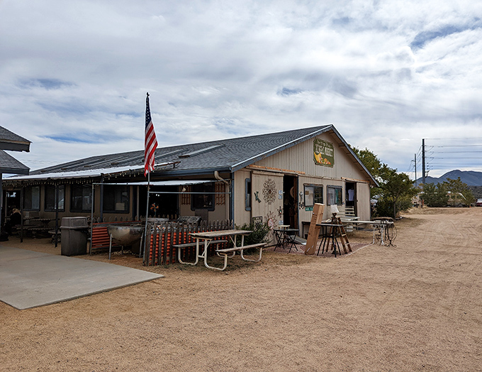 The unassuming headquarters of treasure hunting adventures, where that American flag promises patriotic bargains and desert discoveries await.