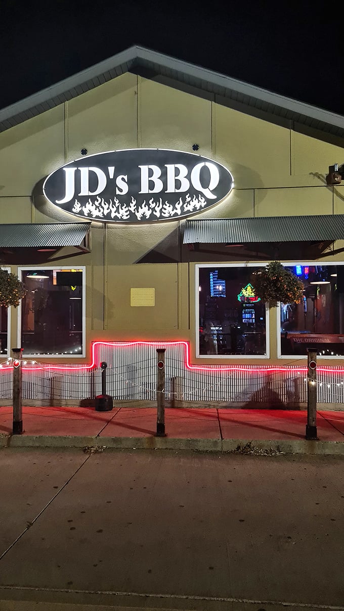 JD's BBQ glows like a smoky beacon in the night, its illuminated sign and red neon trim promising delicious refuge from the North Dakota chill.