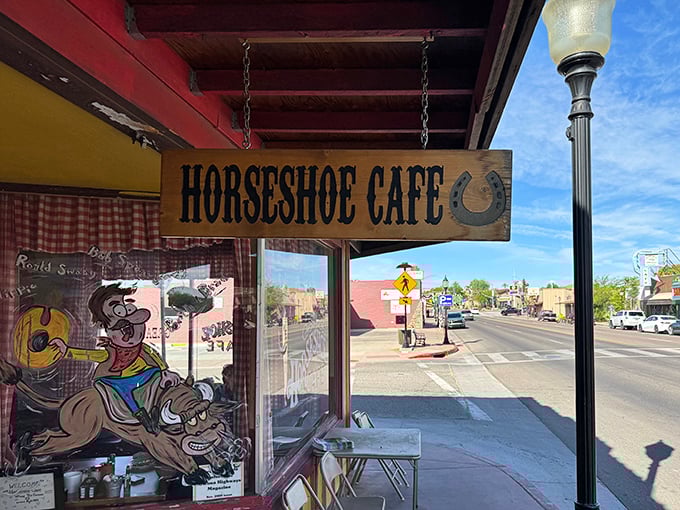 The Horseshoe's wooden sign swings like an Old West saloon door, beckoning hungry travelers off Wickenburg's main drag.