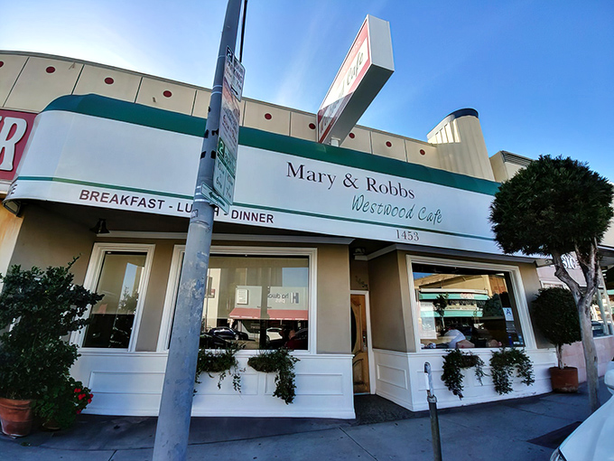 The classic green-trimmed exterior of Mary and Robb's Westwood Cafe stands as a beacon of breakfast hope in a city obsessed with avocado toast and $18 smoothies.