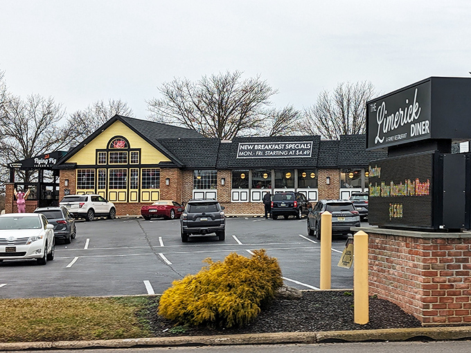 The Limerick Diner stands proudly with its distinctive yellow gable and cupola, like a beacon of comfort food calling weary travelers home.