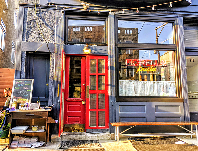 The iconic neon "Fiorella pasta" sign glows like a lighthouse for carb-seeking sailors. This storefront has guided many hungry Philadelphians to pasta paradise.