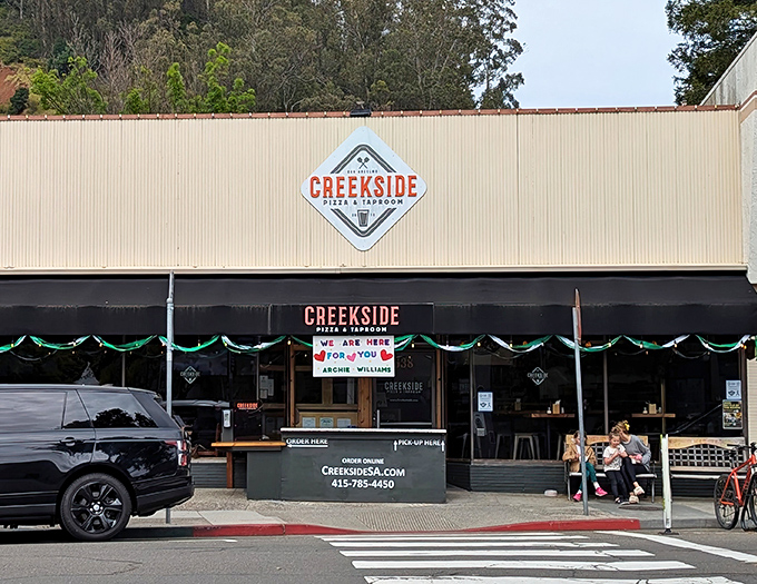 The unassuming exterior of Creekside Pizza & Taproom in San Rafael hides culinary treasures within. Like a superhero's secret identity, it's modest on the outside, magnificent on the inside.