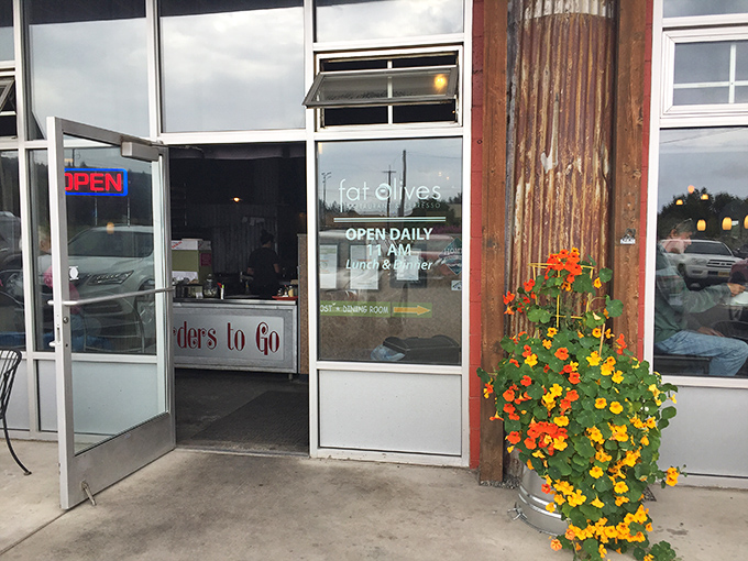 Those cheerful orange and yellow flowers aren't just decoration&mdash;they're nature's way of saying "slow down, hungry traveler, culinary magic happens inside."