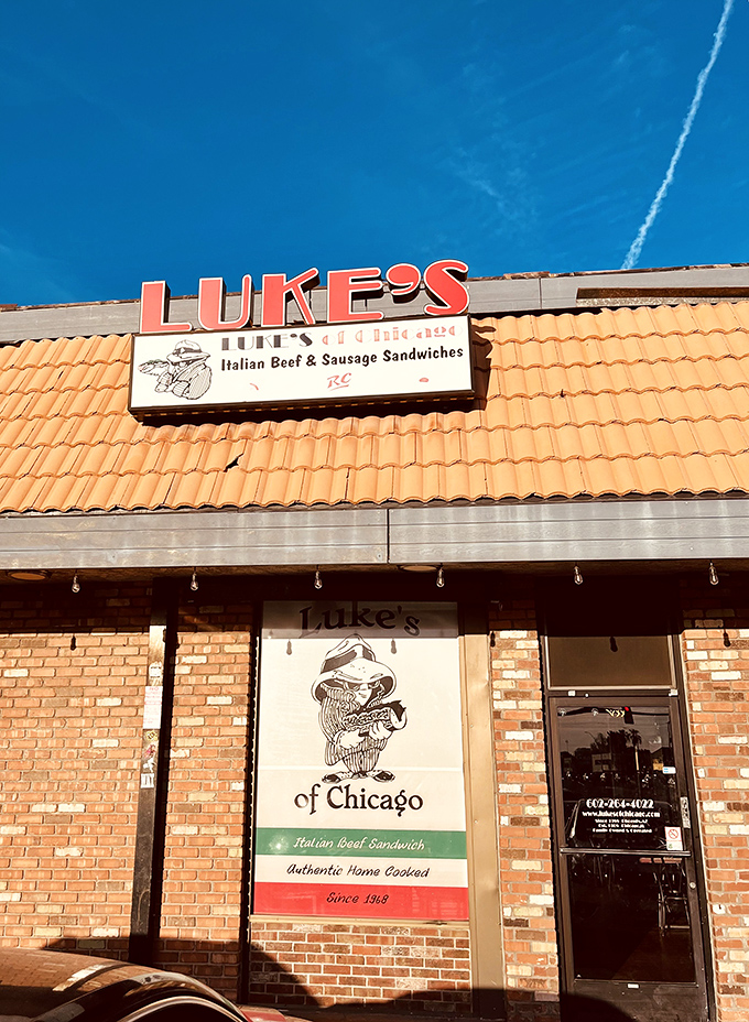 Luke's of Chicago stands like a beacon in the Phoenix night, its warm brick exterior promising Windy City comfort in the desert heat.