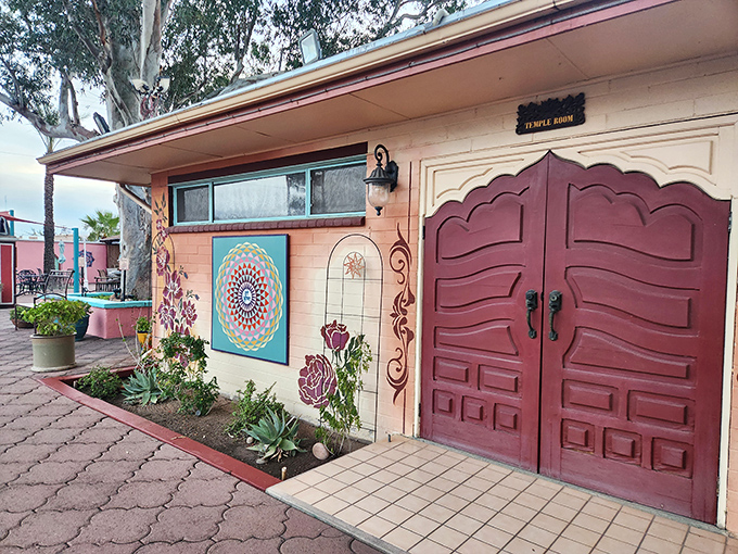 The salmon-colored exterior with its ornate doorway and colorful mandala art isn't just an entrance&mdash;it's an invitation to slow down and nourish your soul.