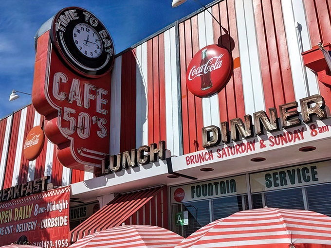 The red and white striped facade of Cafe 50's isn't just eye-catching&mdash;it's a time machine disguised as a diner. That "Time to Eat" clock doesn't lie!