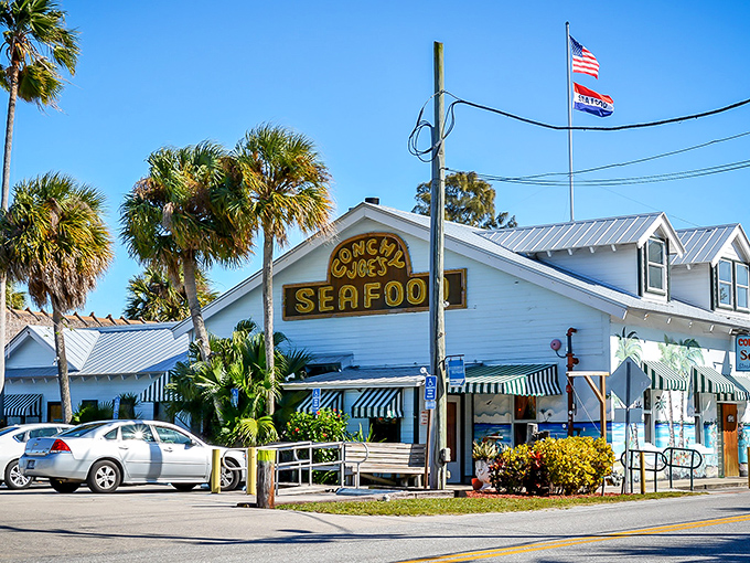 The classic Florida welcome: palm trees, sunshine, and a seafood sign that practically winks at you as you pull up.