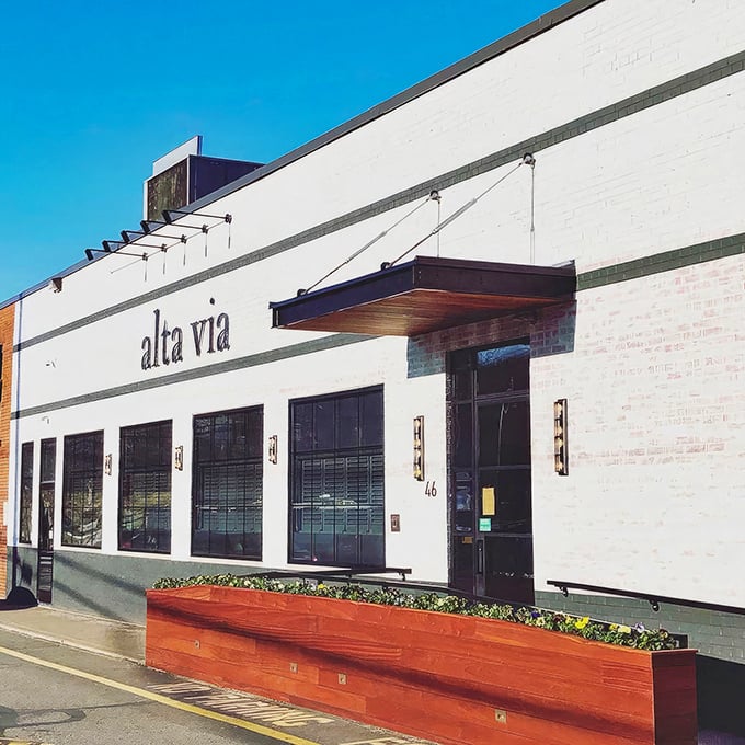 Minimalist elegance in white brick—Alta Via's exterior is like that friend who doesn't need flashy clothes to make an impression.