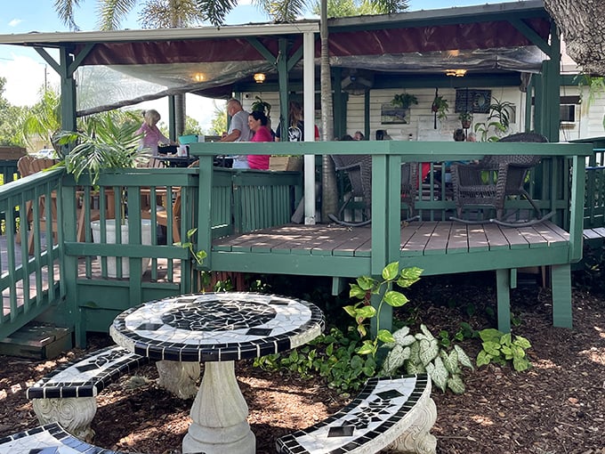 The unassuming charm of Peace River Seafood's exterior promises what fancy restaurants rarely deliver: authenticity wrapped in Old Florida nostalgia.