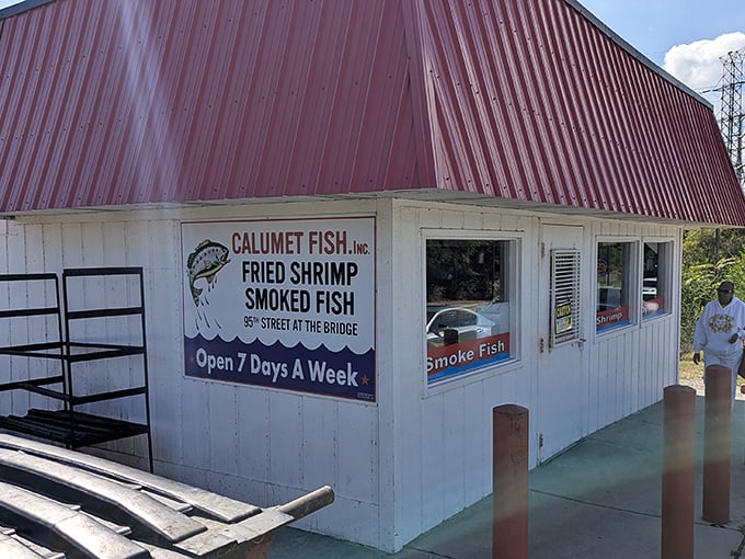 The iconic red-roofed shack at the edge of the Calumet River stands as a testament to Chicago's enduring love affair with perfectly smoked seafood.