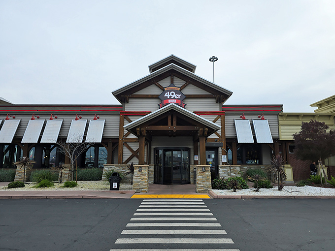 The 49er Diner's rustic exterior beckons with its wooden beams and stone accents, promising Gold Rush-era comfort in modern Sacramento.
