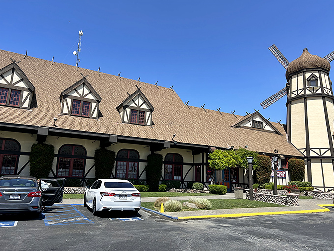 The iconic windmill of Pea Soup Andersen's stands like a Danish mirage in the California heat, beckoning road-weary travelers with promises of comfort food and quirky charm.