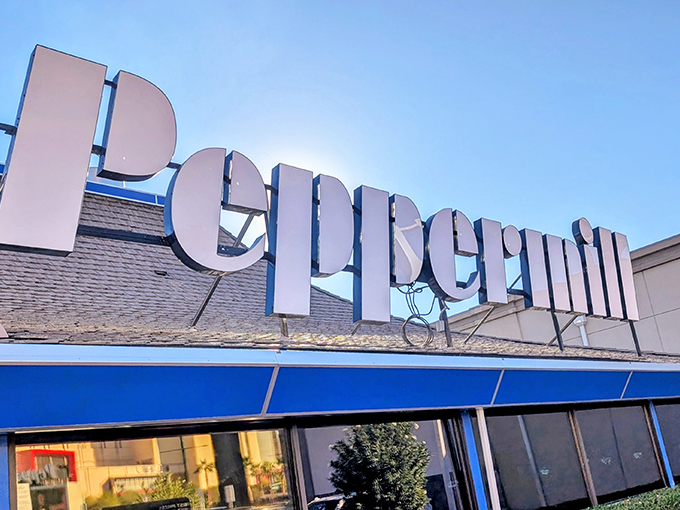 The iconic Peppermill sign stands proud against the Vegas sky, a neon beacon promising retro delights in a city that rarely preserves its past.
