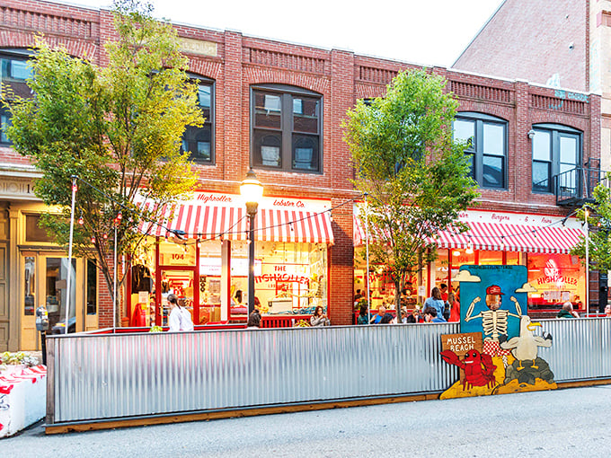 The red-and-white striped awnings of Highroller Lobster Co. pop against Portland's historic brick buildings like a carnival for seafood lovers.