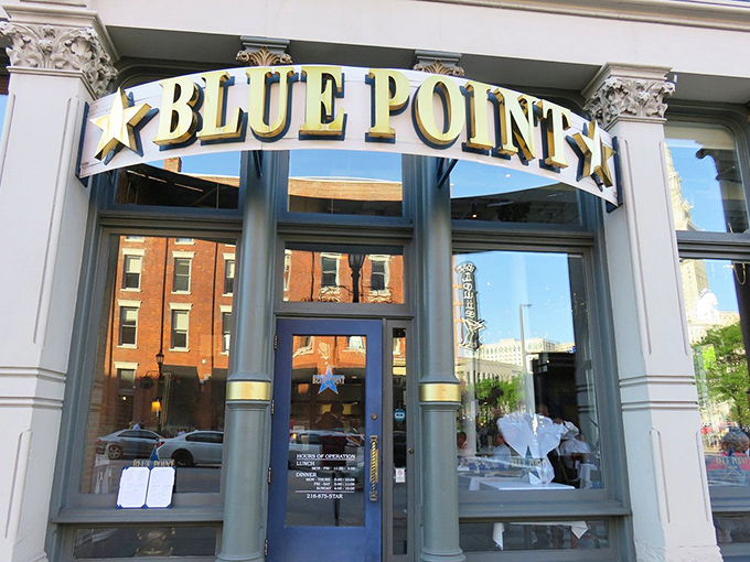 A closer view of Blue Point's welcoming storefront, where the historic Warehouse District architecture meets maritime culinary excellence. The journey to lobster nirvana begins here.