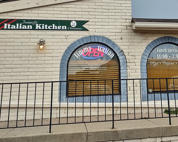 The unassuming exterior of Jimmy's Italian Kitchen hides culinary treasures within, like finding a Ferrari parked behind a garden shed.