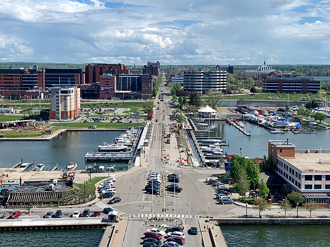 Erie's skyline rises majestically from the waterfront, where sailboats glide past the iconic lighthouse tower&mdash;urban sophistication meets Great Lakes charm. 