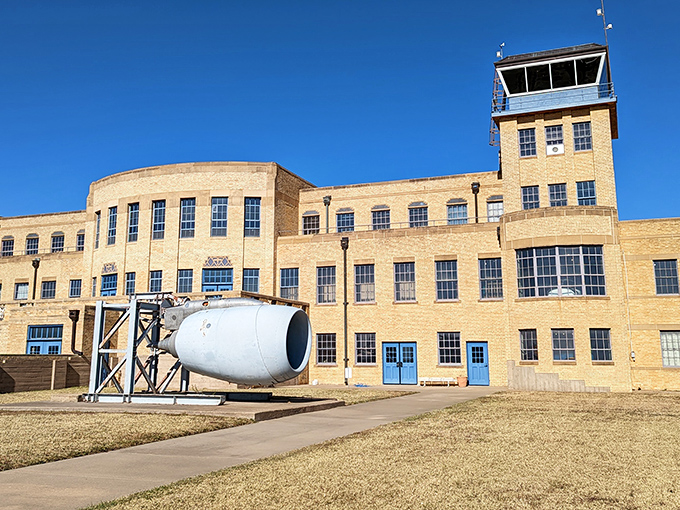 The Art Deco masterpiece that houses the Kansas Aviation Museum stands proudly against the Kansas sky, a buff-colored time capsule with its distinctive control tower keeping watch.