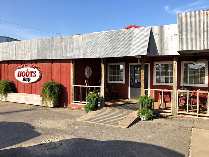 The rustic wooden exterior of Hoot's BBQ promises authentic Southern comfort without any pretense. Like finding a treasure map where X marks the spot.