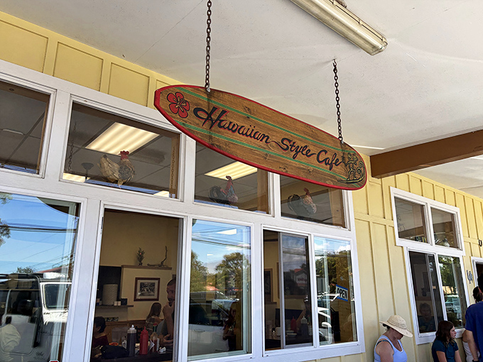 That iconic surfboard sign welcomes you like an old friend. No pretense, just the promise of island comfort food that'll make you sigh.