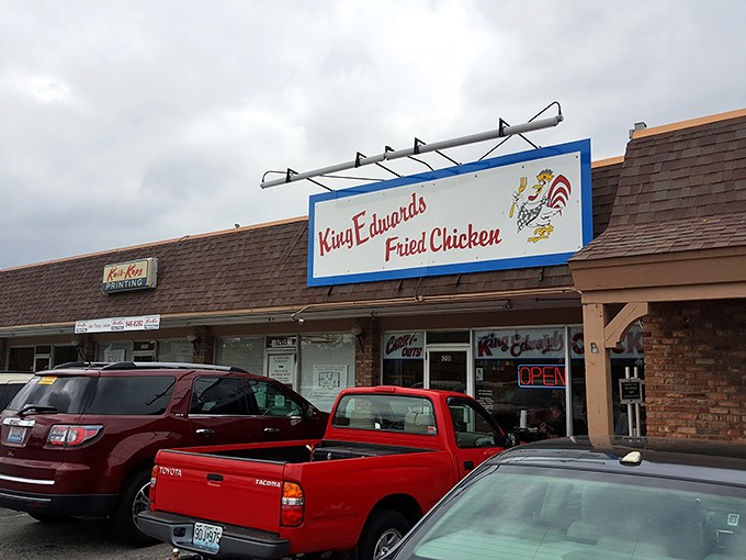 The unassuming storefront of King Edwards Fried Chicken stands as a beacon to those in the know. No fancy frills needed when your chicken speaks volumes.