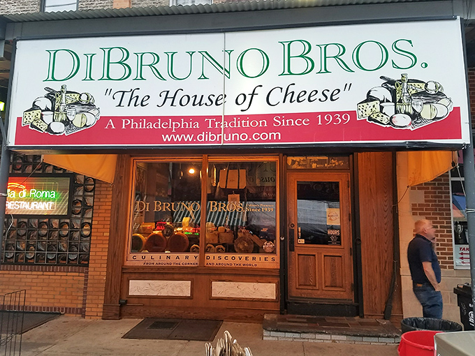 The iconic Villa di Roma neon sign beckons hungry travelers along Philadelphia's historic Italian Market, promising old-world flavors in a neighborhood where tradition reigns supreme.