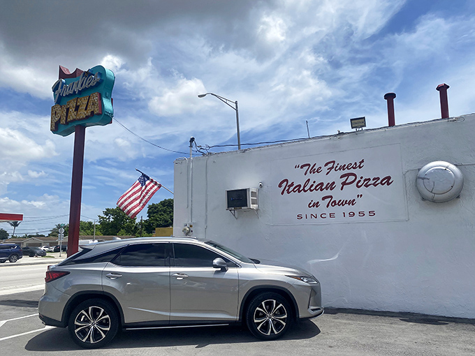 The side of the building proudly declares "Finest Italian Pizza in Town" since 1955&mdash;a bold claim that generations of loyal customers confirm is no exaggeration.