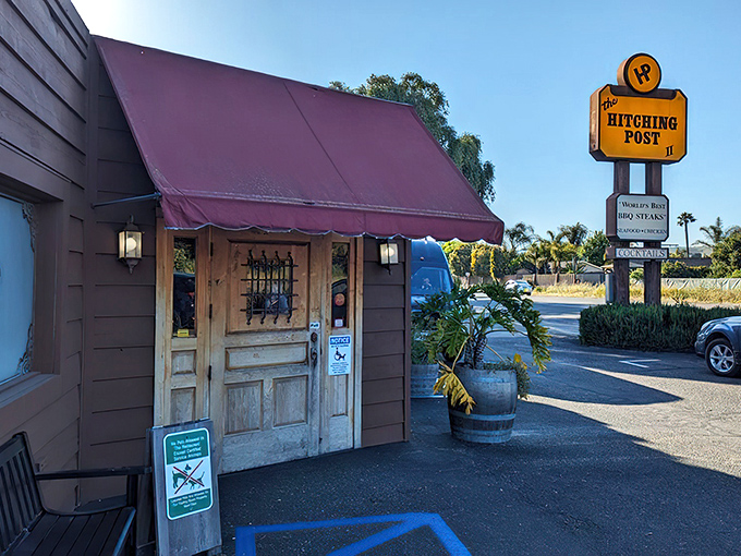 The unassuming entrance to culinary paradise. Hitching Post 2's rustic wooden doors and iconic sign promise a steak experience worth the journey to Buellton.