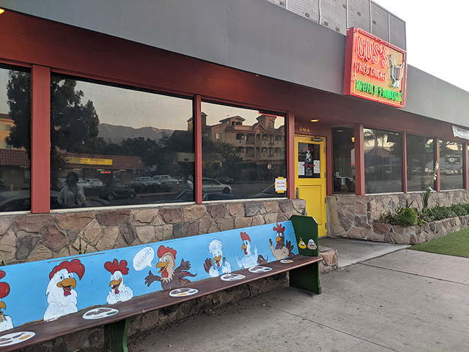 A colorful bench awaits outside this fried chicken temple. You know the crispy, spicy magic within is worth the pilgrimage.