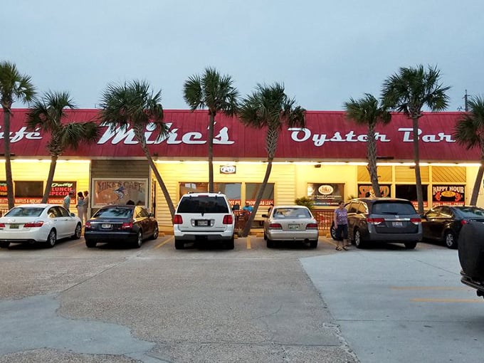 The iconic red roof of Mike's Oyster Bar stands out against the Florida sky like a culinary lighthouse, beckoning hungry seafood lovers from miles around.
