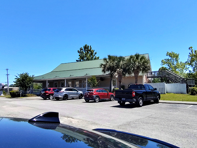 The unassuming exterior promises what fancy restaurants rarely deliver: food that makes you forget your manners and reach for seconds without apology.