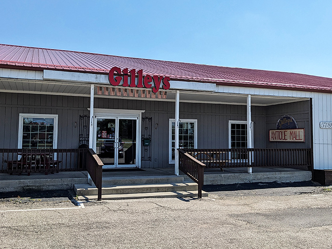The unassuming exterior of Gilley's hides a universe of treasures within, like finding a portal to the past disguised as a simple country building.